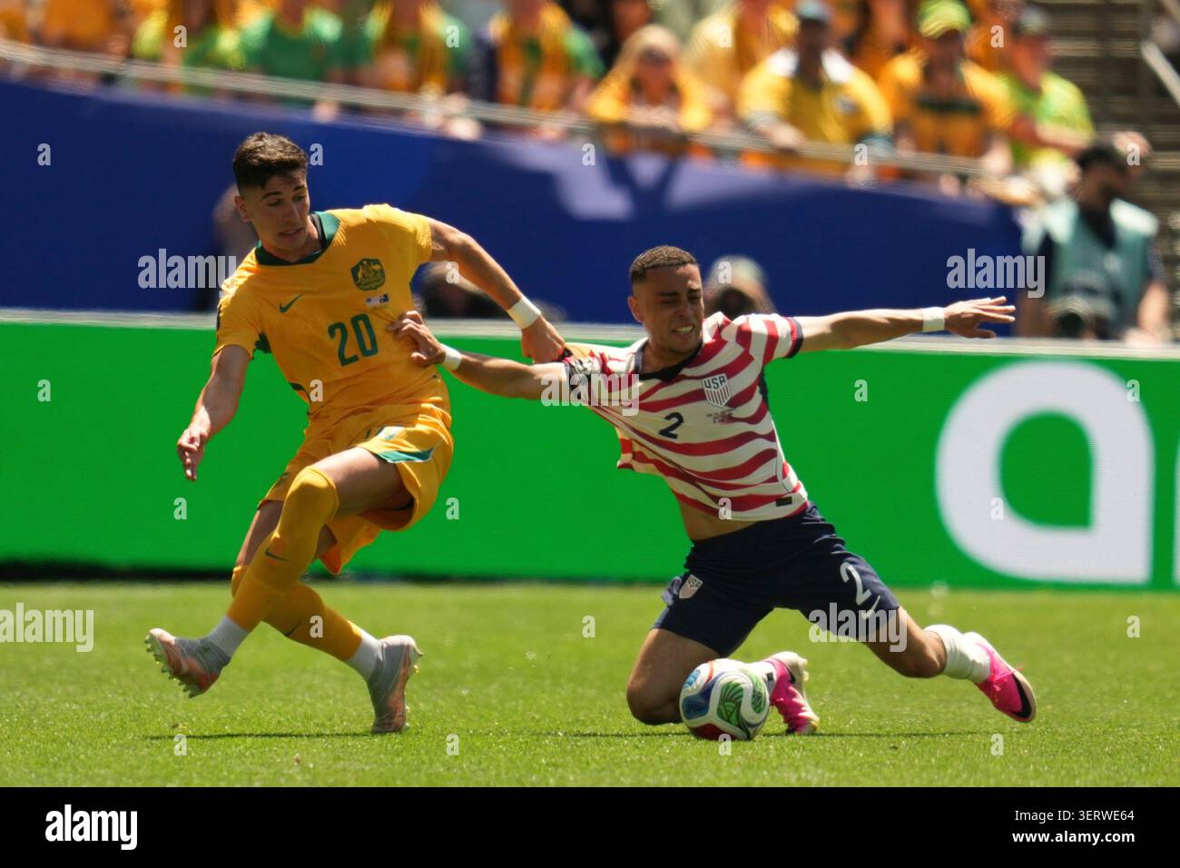 Australia's Cristian Volpato (20) challenges for the ball with United ...