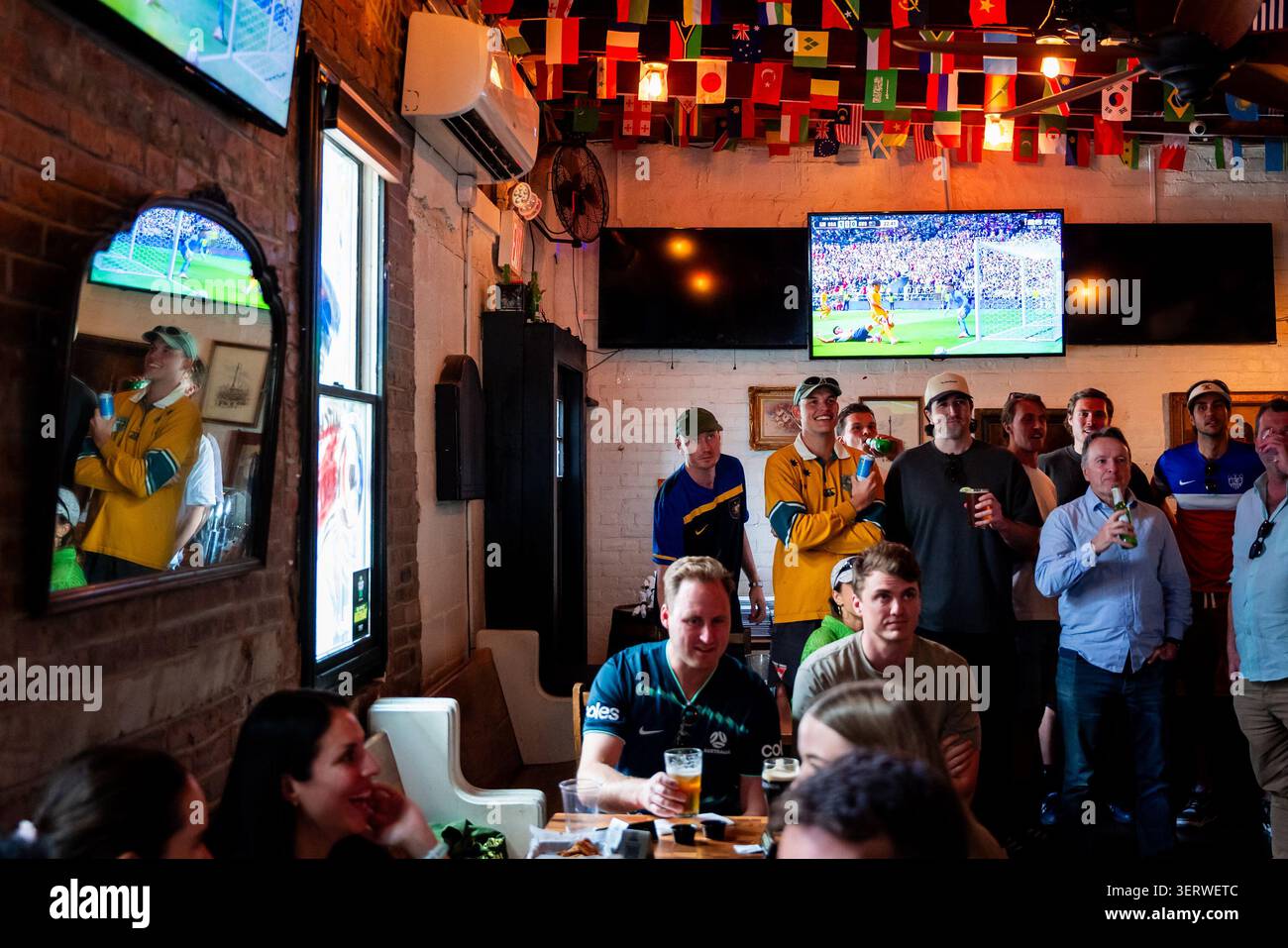 People attend a watch party at Kent Ale House in New York for a ...