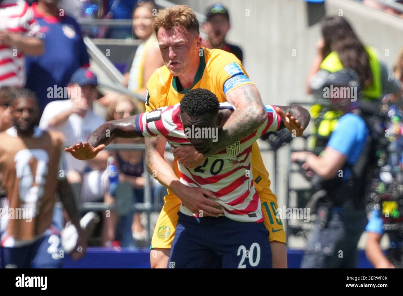 Australia's Harry Souttar (19) holds United States' Folarin Balogun (20 ...