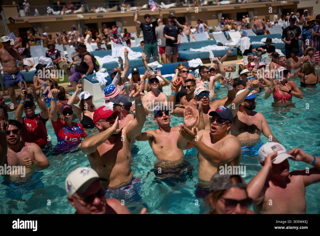 Fans cheer from a pool at the Circa Resort & Casino while watching a ...