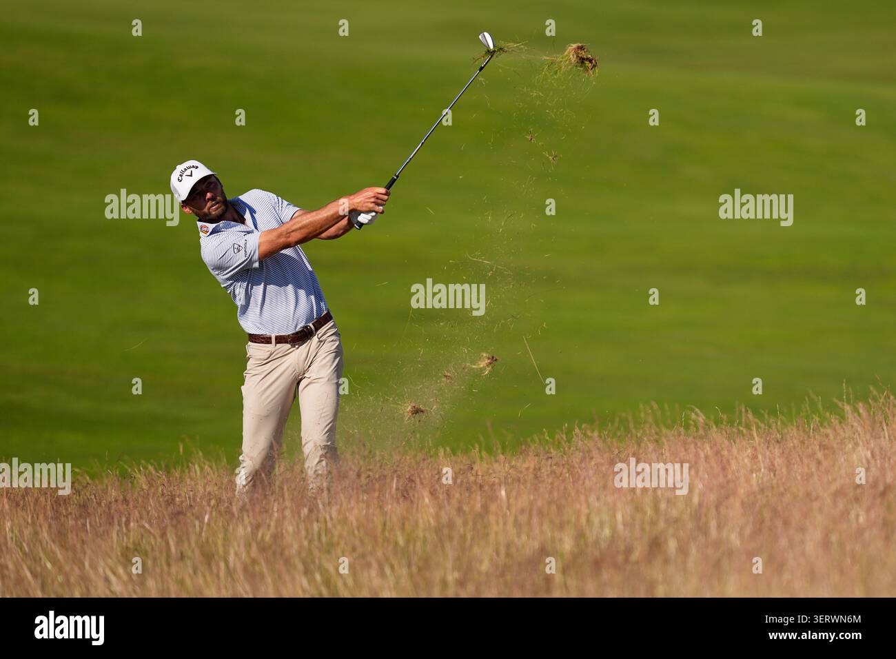 Sam Burns hits from the tall fescue on the 13th hole during the second ...