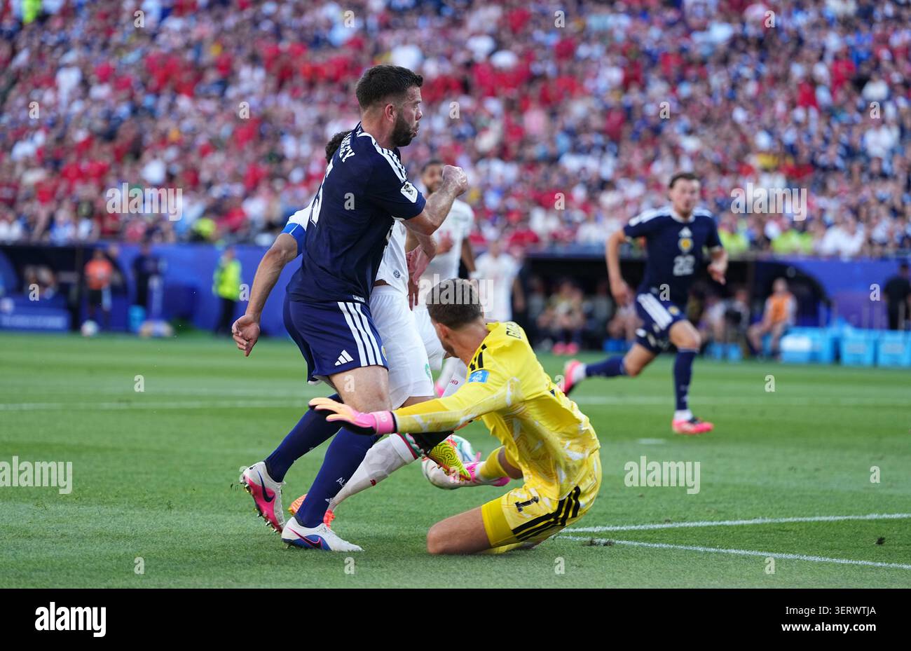 Achraf Hakimi (Morocco) and Grant Hanley (Scotland) battle for the ball ...