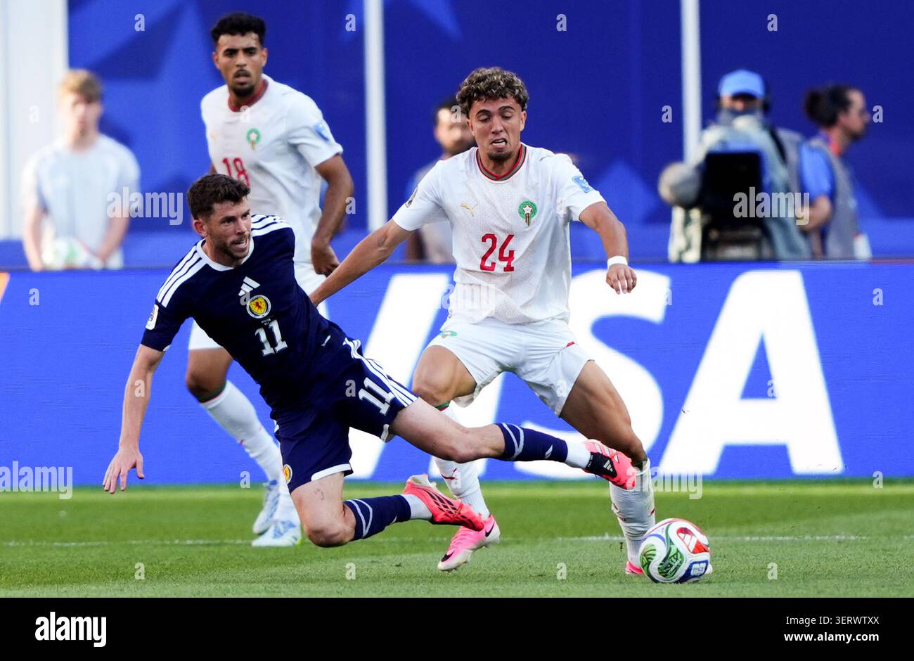 Scotland's Ryan Christie and Morocco's Neil El Aynaoui (right) battle ...