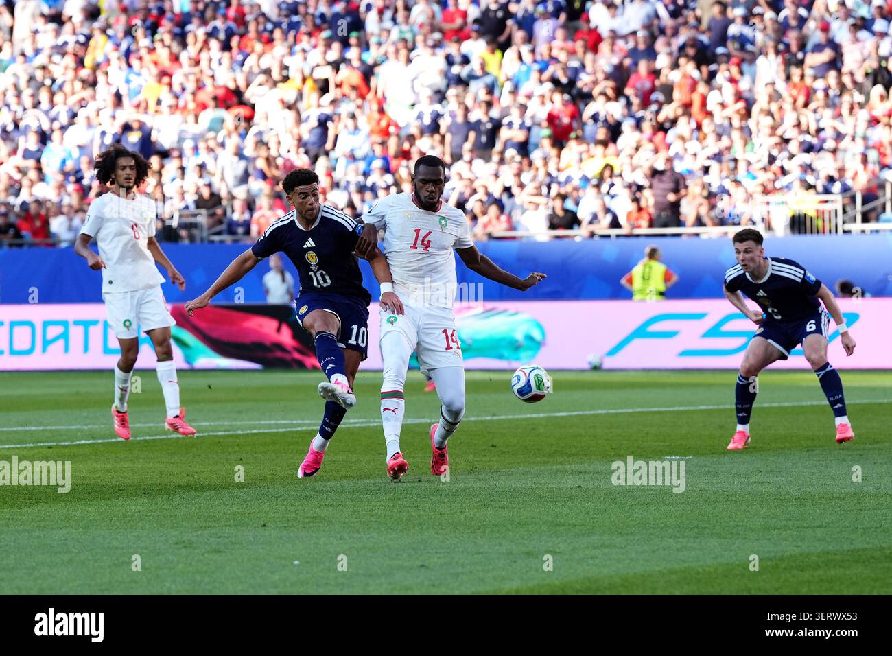 Scotland's Che Adams (centre left) attempts a shot on goal during the ...