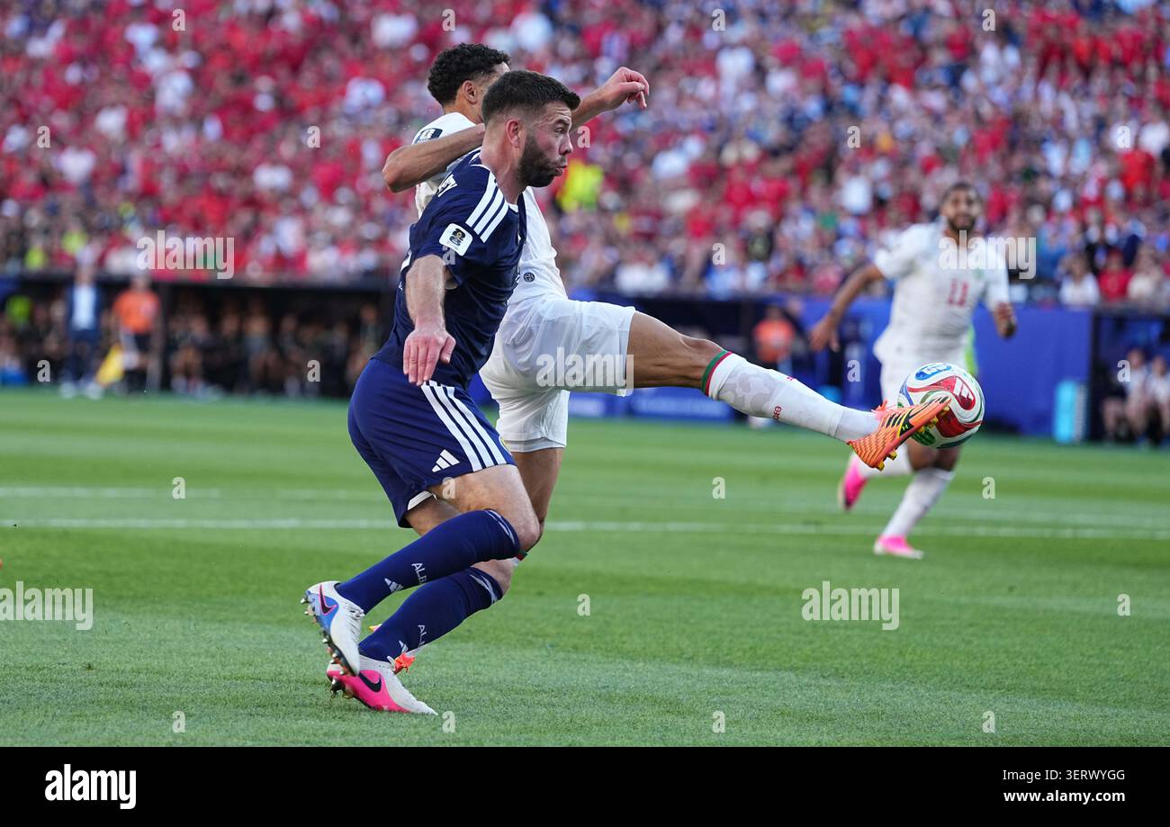 Achraf Hakimi (Morocco) and Grant Hanley (Scotland) battle for the ball ...