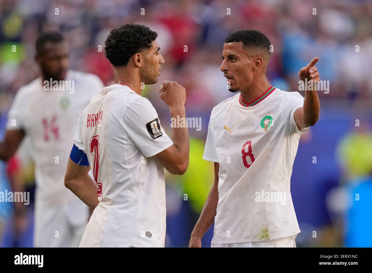 Morocco's Achraf Hakimi, left, and teammate Morocco's Azzedine Ounahi ...