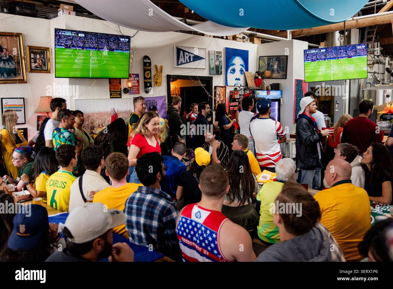 Socceroos fans and USA fans at a watch party for the Australia vs. USA ...