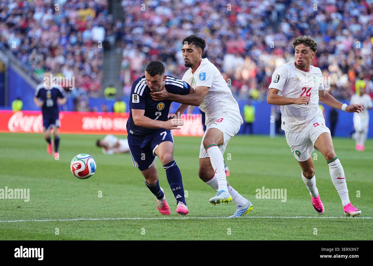 John McGinn (Scotland) and Chadi Riad (Morocco) battle for the ball ...