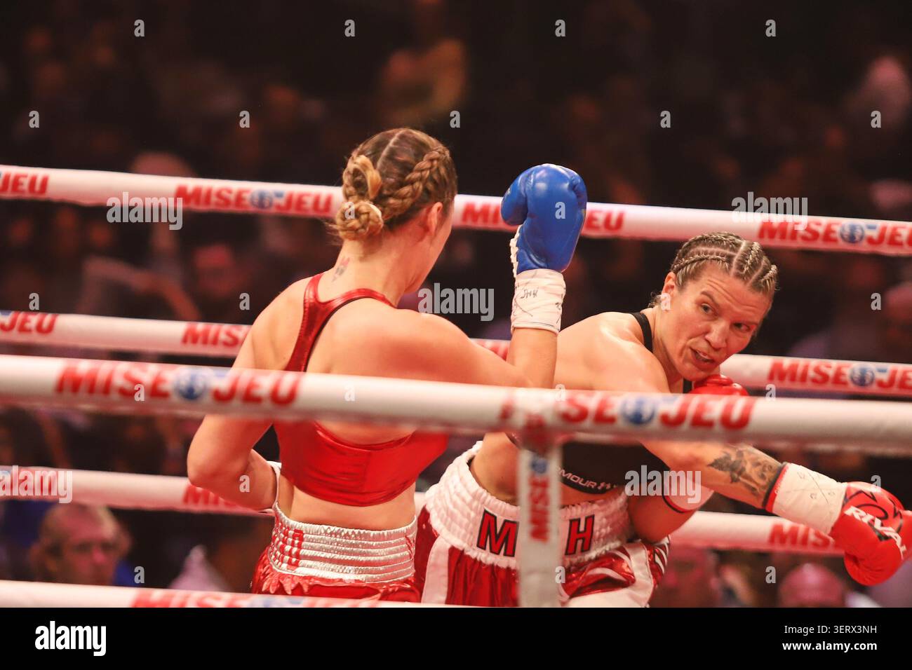 Canadian boxer Marie-Pier Houle throws a punch against Mexican boxer ...