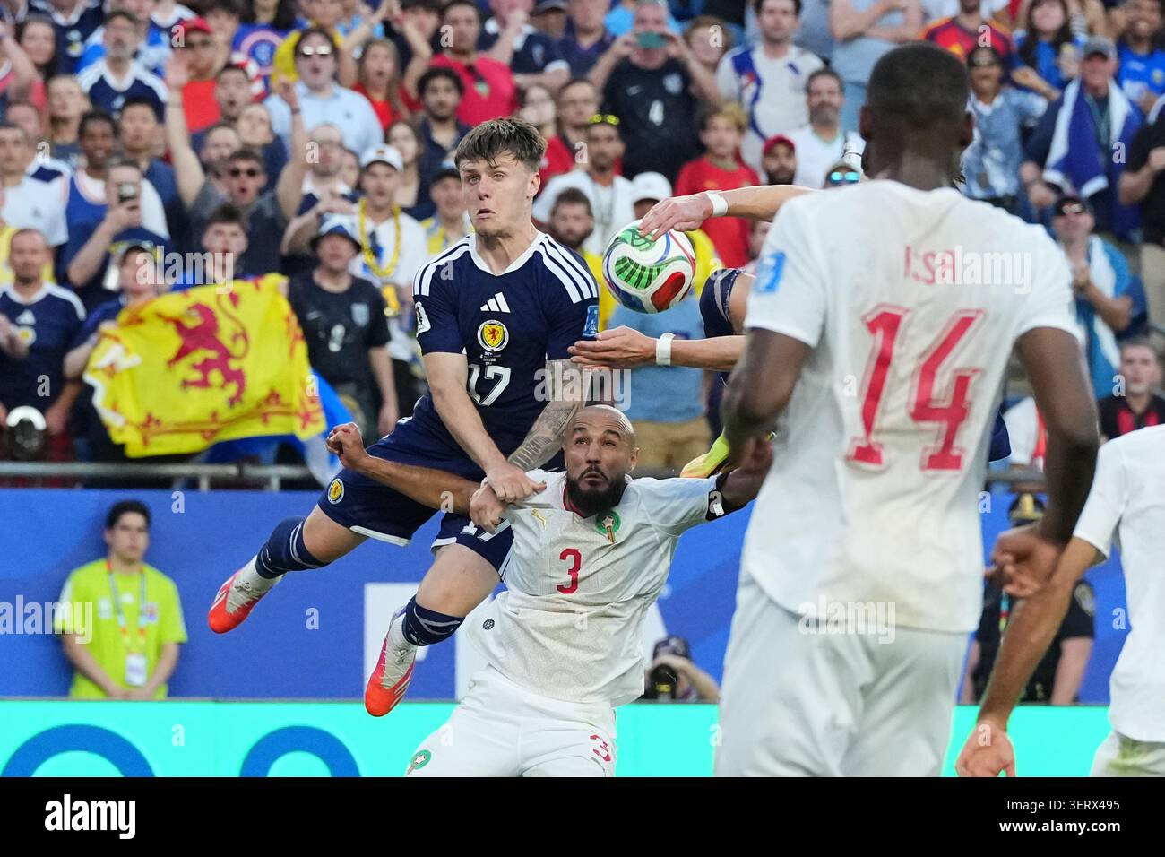 Scotland's Ben Gannon-Doak, top, jumps over Morocco's Noussair Mazraoui ...