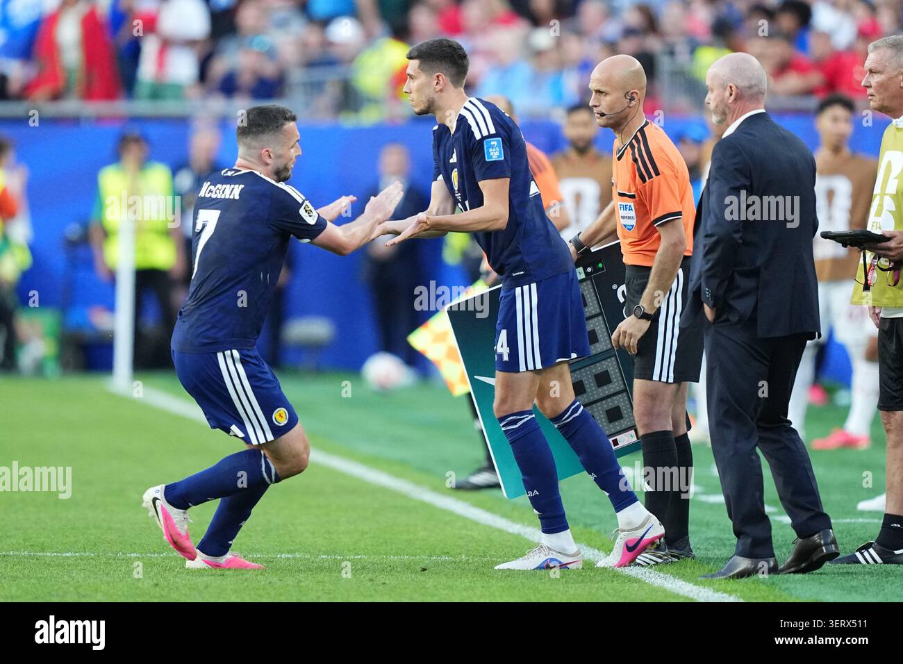 Scotland's John McGinn, left, shakes hands with Ross Stewart after ...