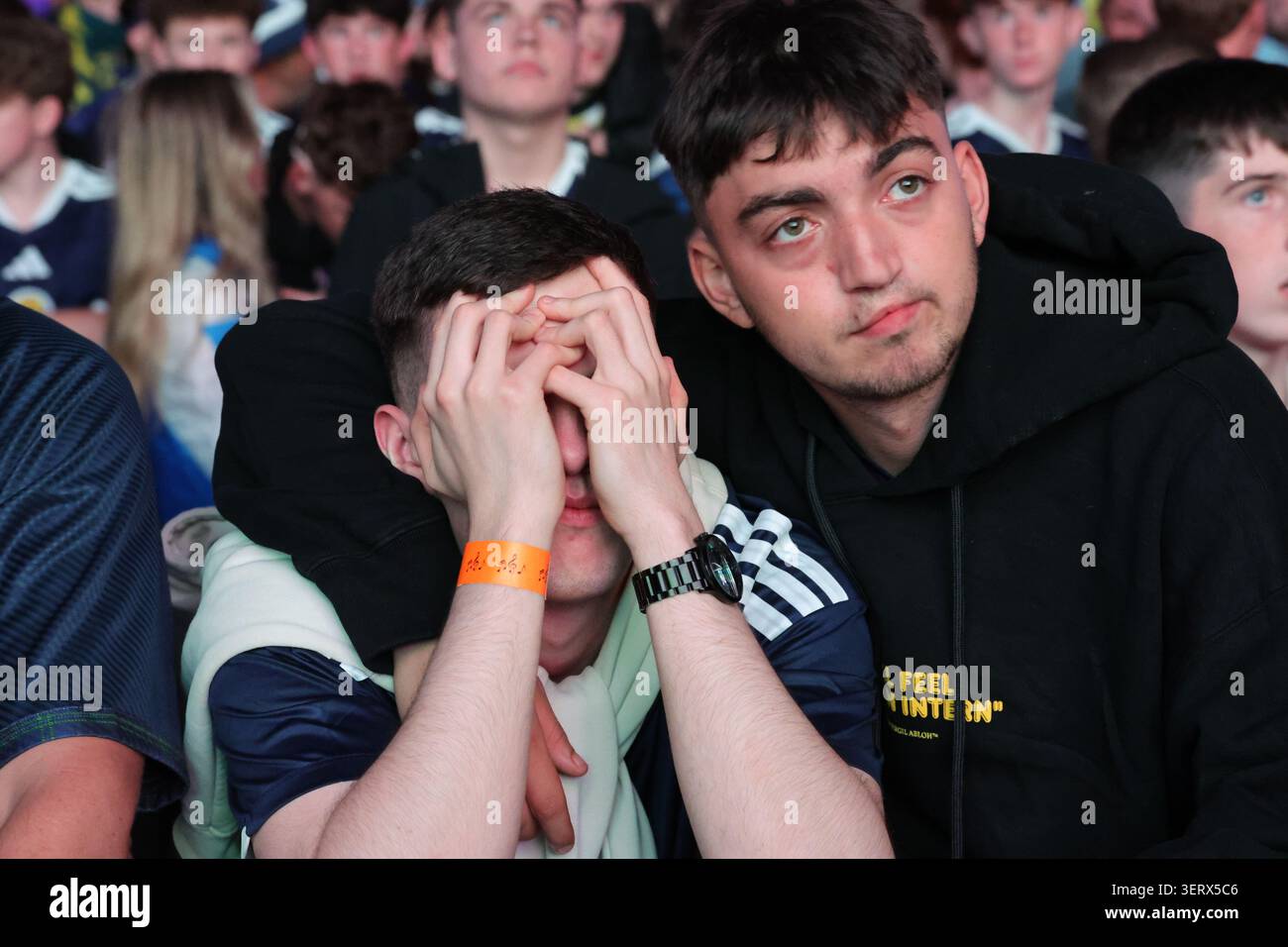 Scotland fans react after they lose to Morocco during a screening of ...