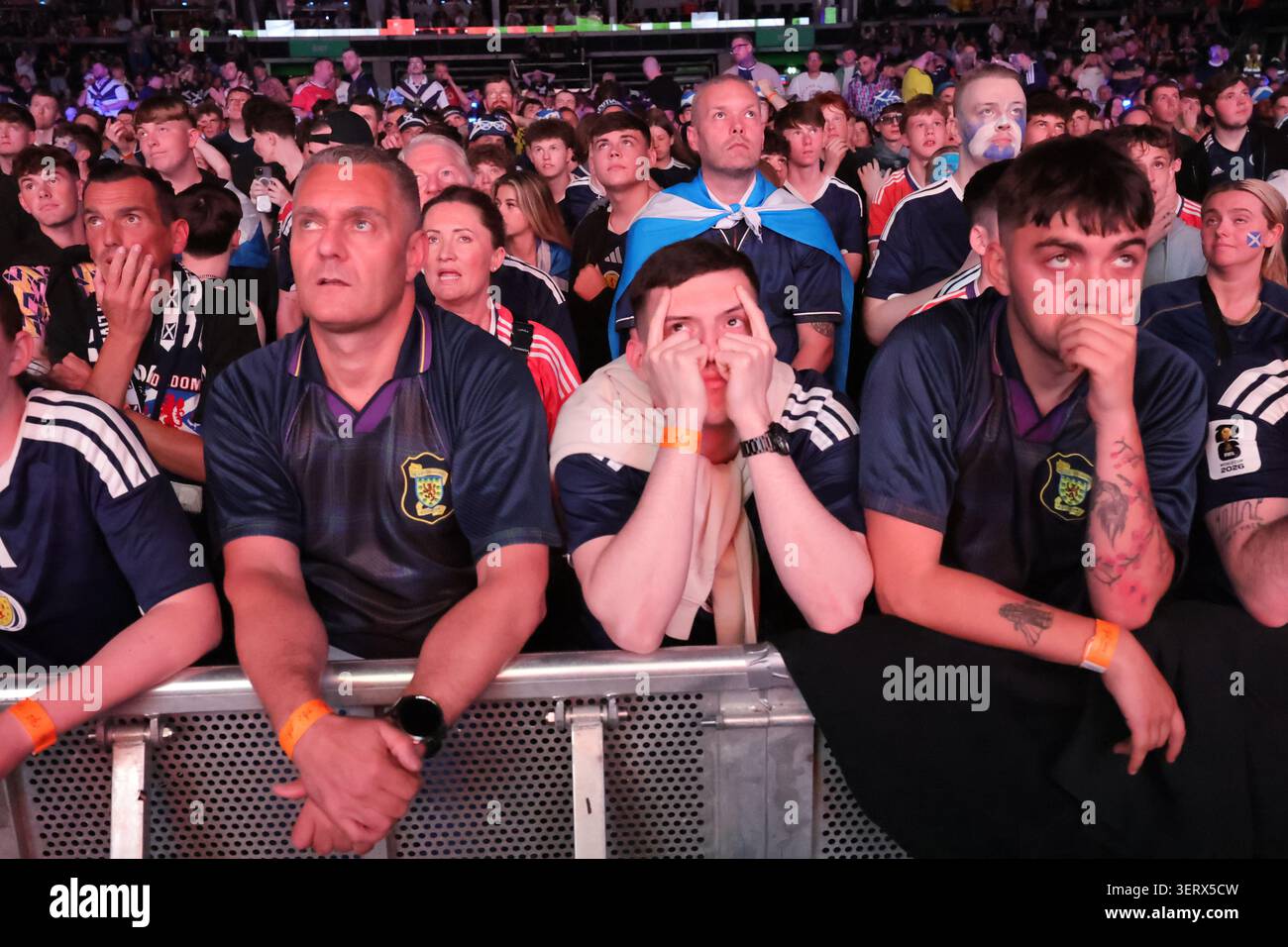 Scotland fans react after they lose to Morocco during a screening of ...