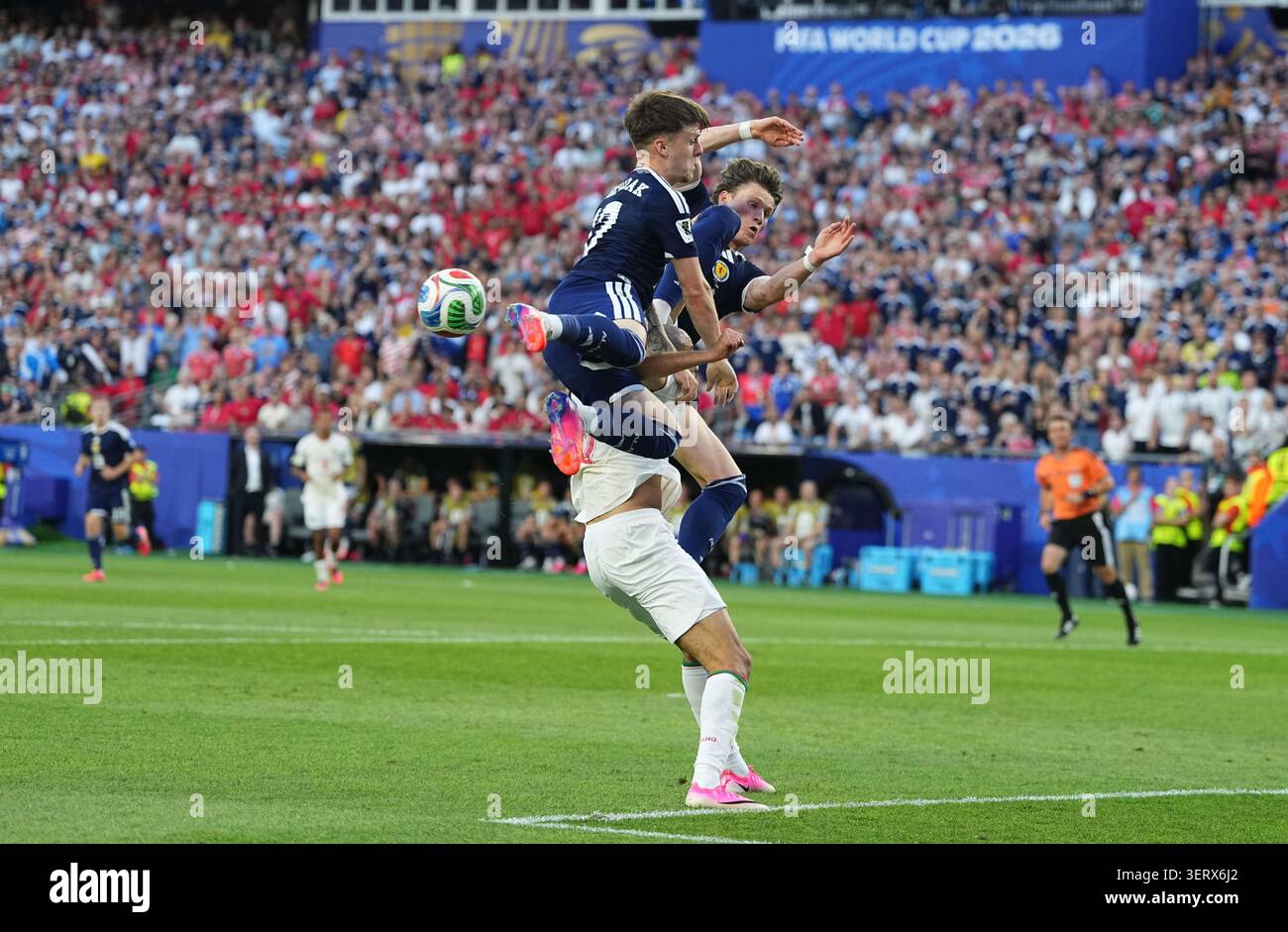 Noussair Mazraoui (Morocco) and Scott McTominay (Scotland) battle for ...
