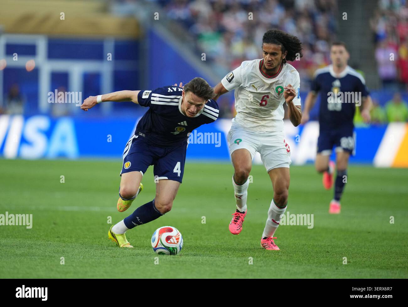 Scott McTominay (Scotland) and Ayyoub Bouaddi (Morocco) battle for the ...