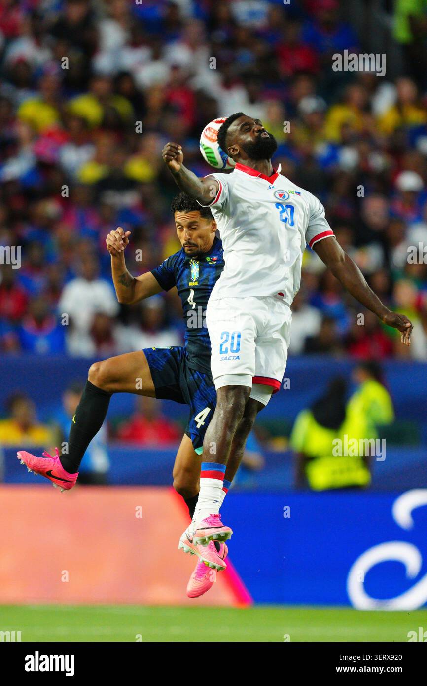 Haiti's Frantzdy Pierrot (20) battles for a header with Brazil's ...