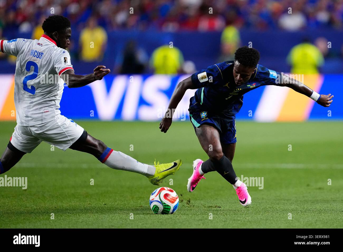 Brazil's Vinicius Junior (7) battles for the ball with Haiti's Carlens ...