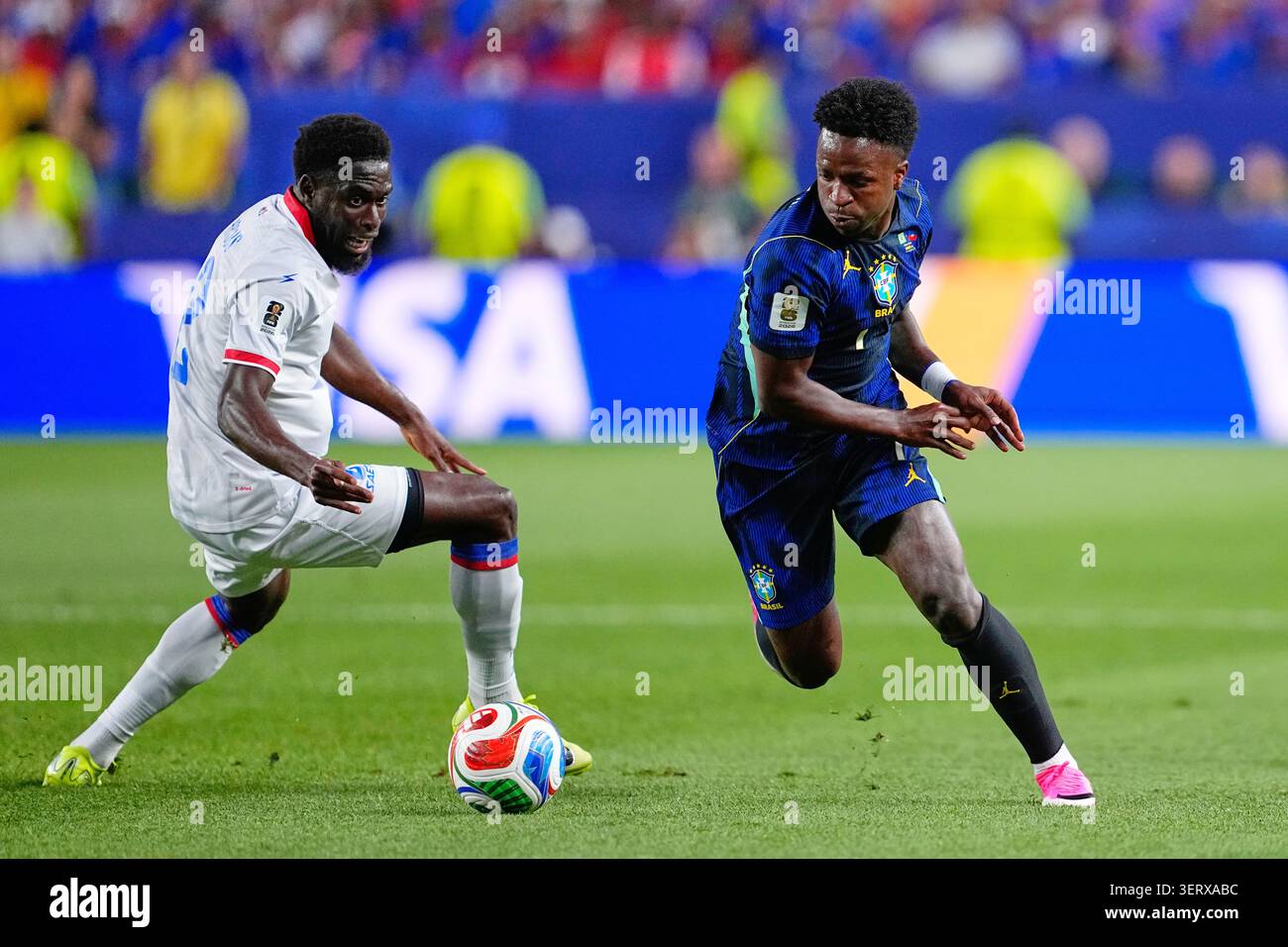 Brazil's Vinicius Junior (7) battles for the ball with Haiti's Carlens ...