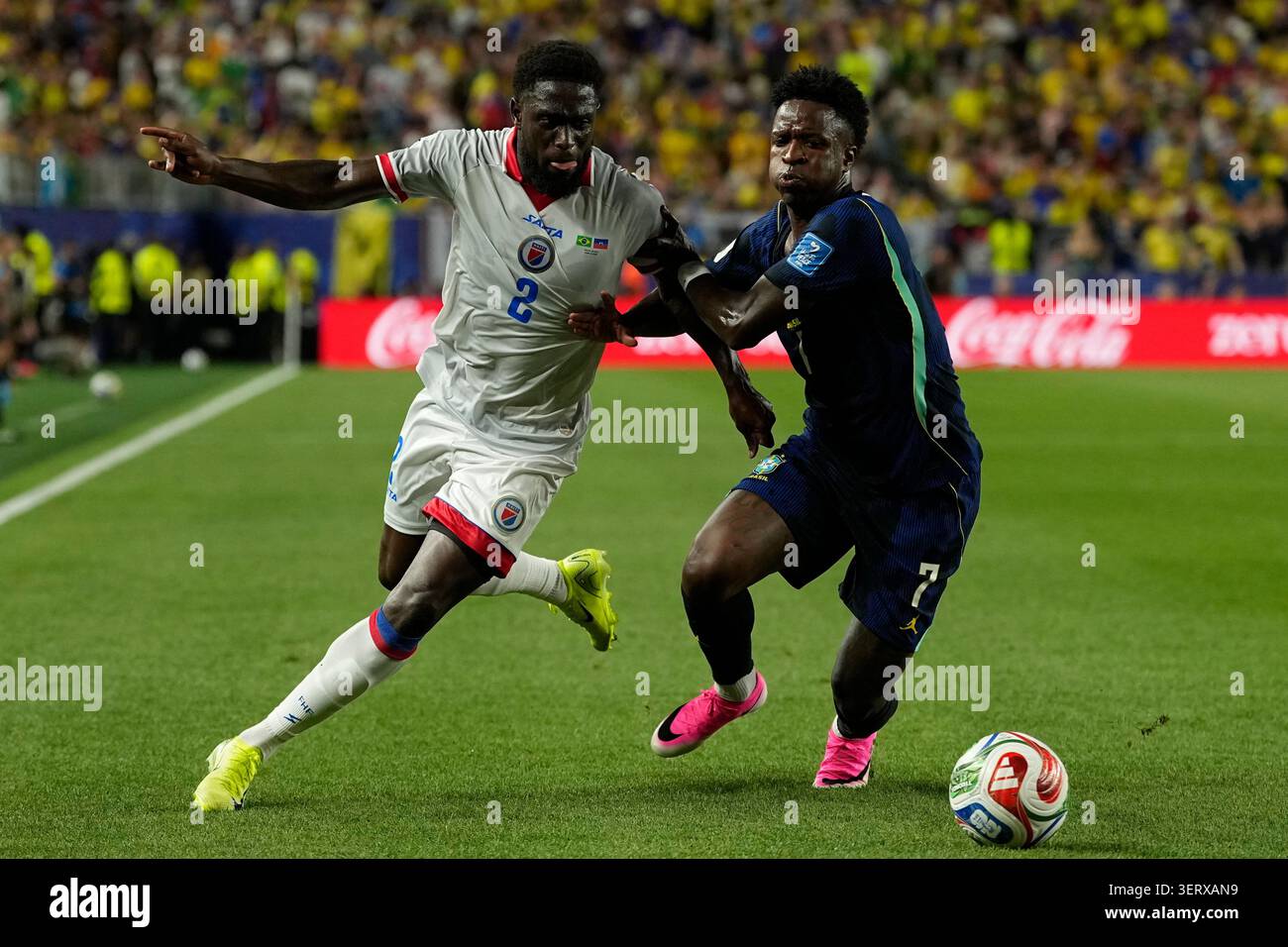 Haiti's Carlens Arcus, left, and Brazil's Vinicius Junior fight for the ...