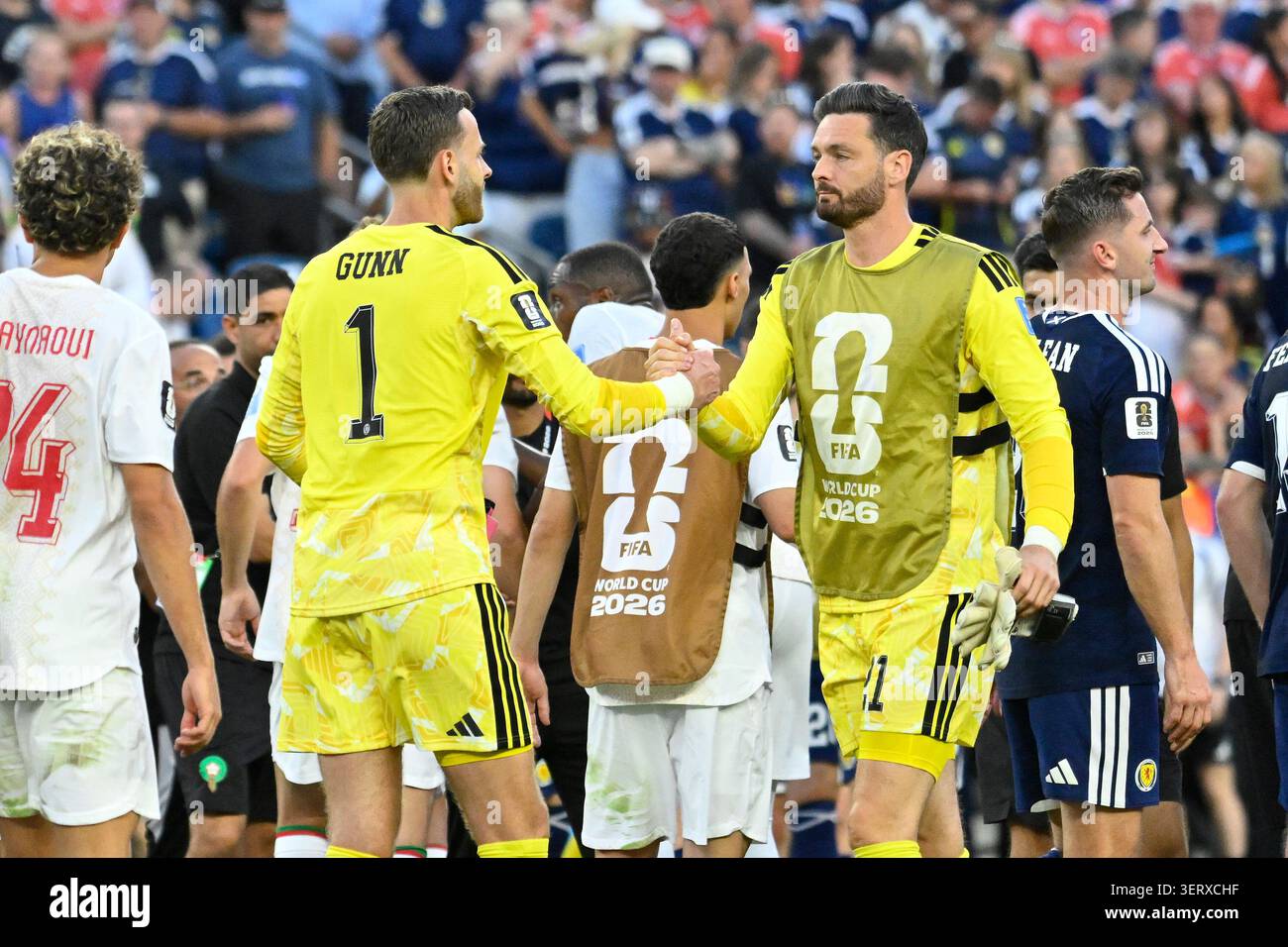 Scotland goalkeeper Craig Gordon #21 and goalkeeper Angus Gunn #1 shake ...