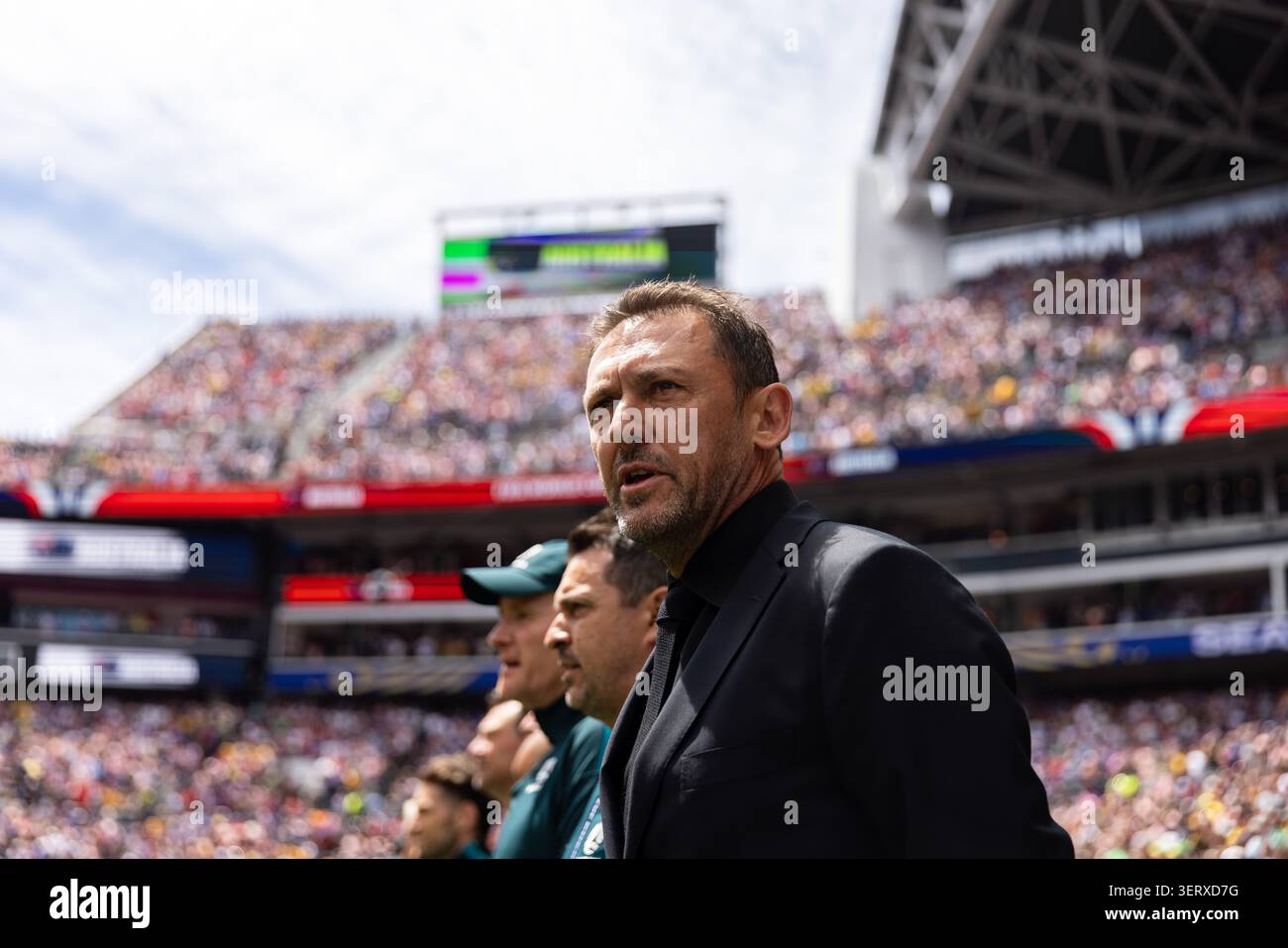 Seattle, USA. 19 June 2026. Australia coach Tony Popovic looks on at ...