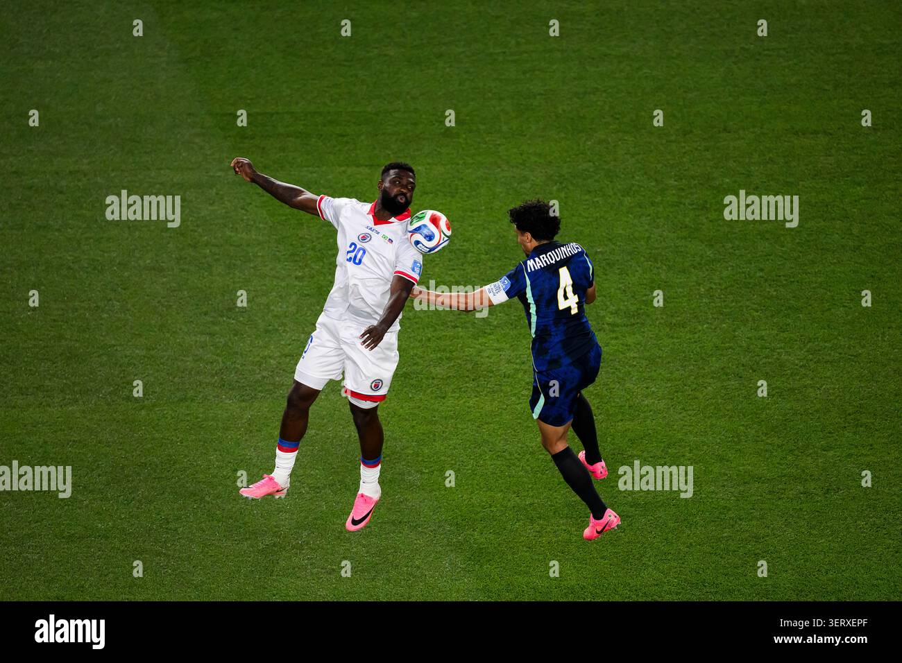 Frantzdy Pierrot of Haiti competes for a header with Marquinhos of ...