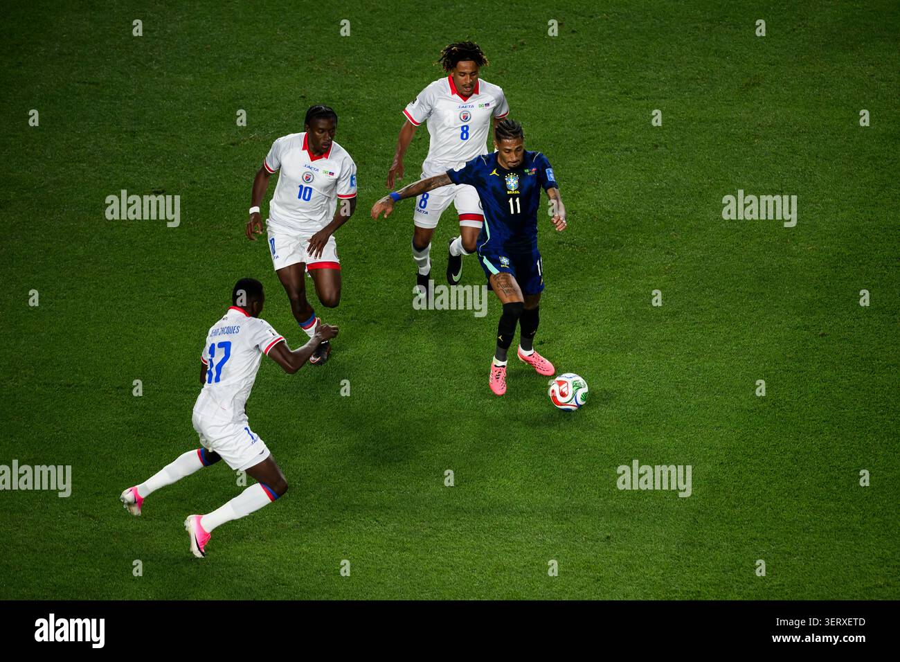 Raphinha of Brazil is challenged by Danley Jean Jacques, Jean-Ricner ...
