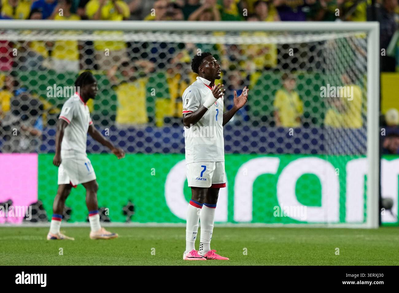 Haiti's Derrick Etienne reacts at the end of the World Cup Group C ...