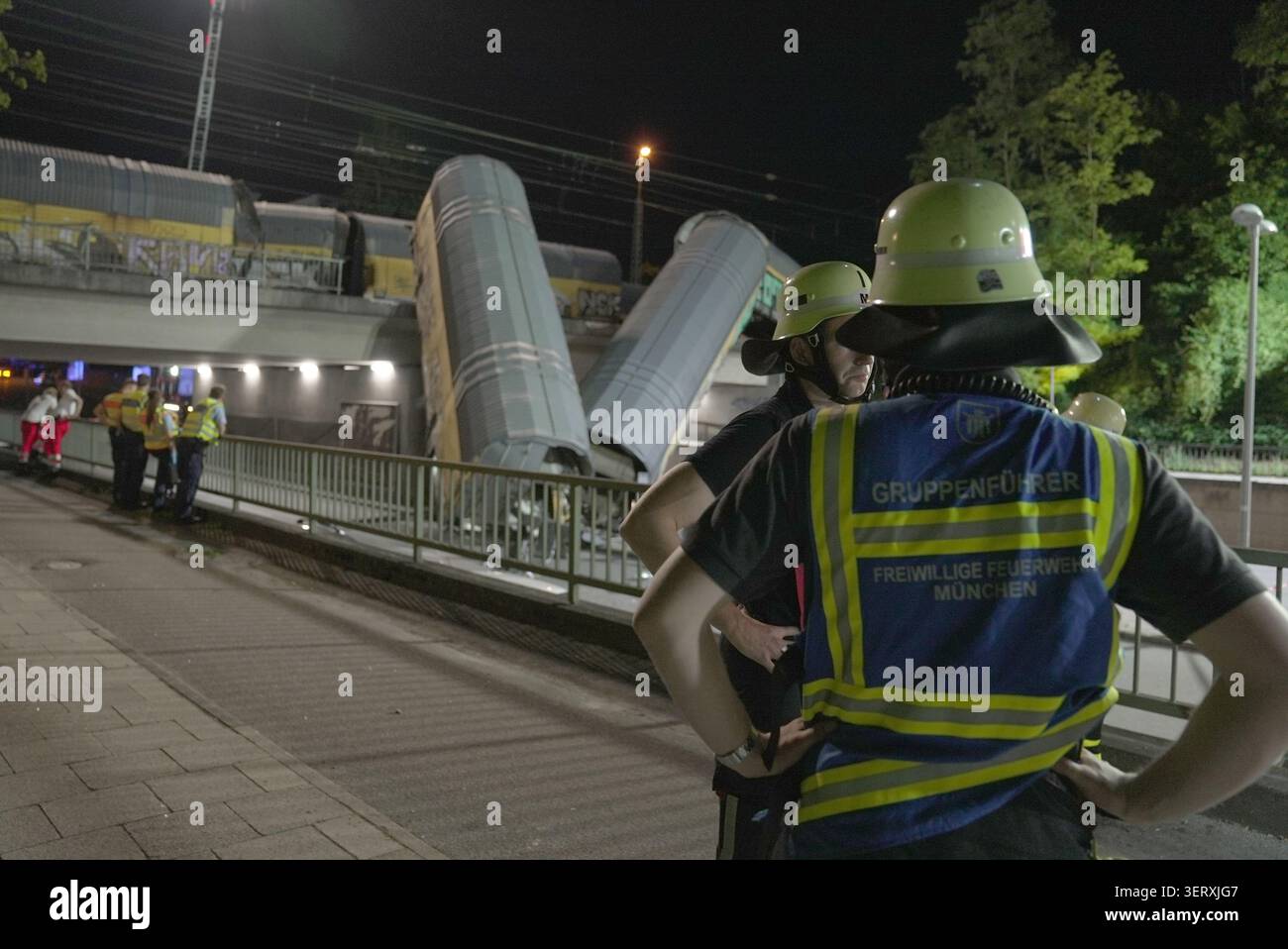 20 June 2026, Bavaria, Munich: Two cars of a freight train are lying on ...