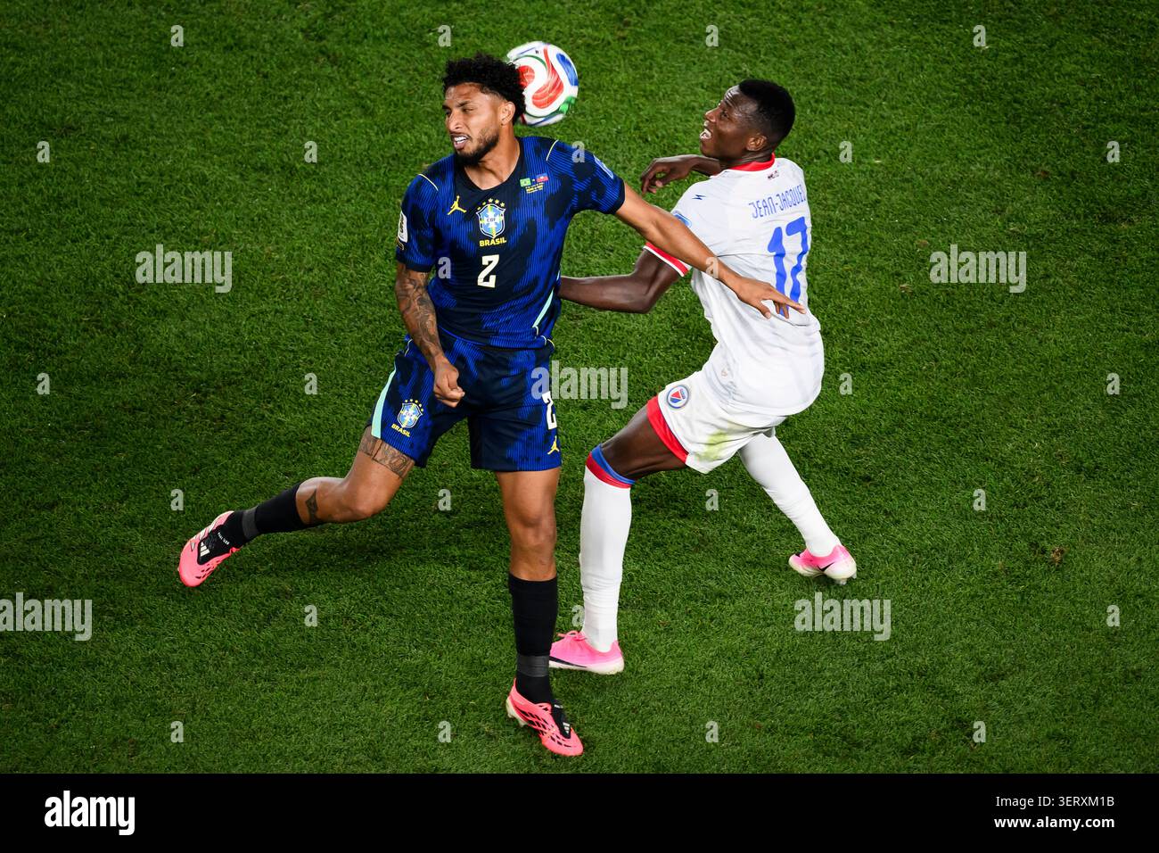 Ederson Silva of Brazil competes for the ball with Danley Jean Jacques ...