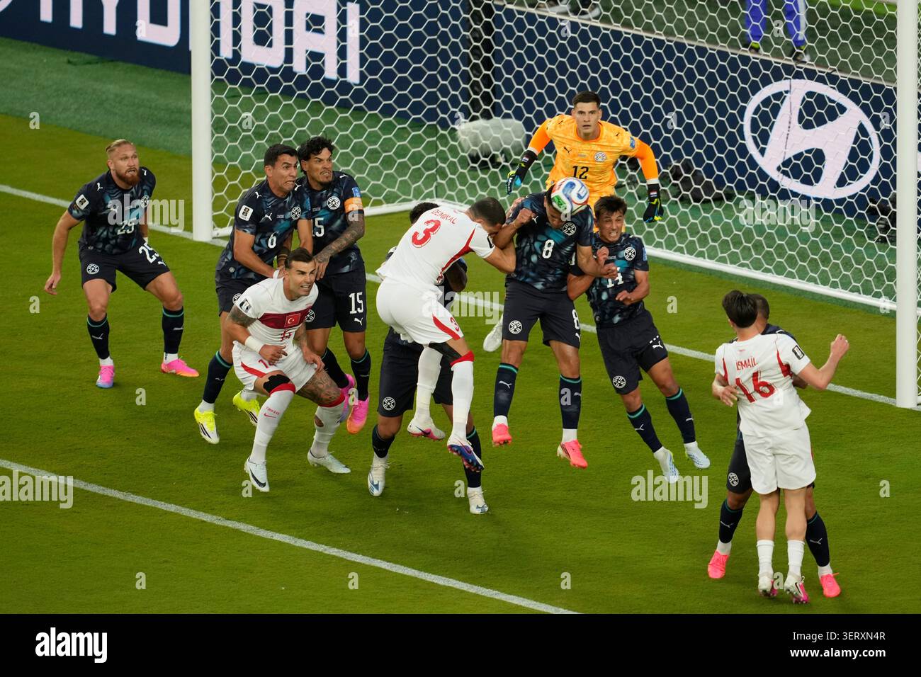 Paraguay's Diego Gomez (8) heads a ball next to Turkey's Merih Demiral ...