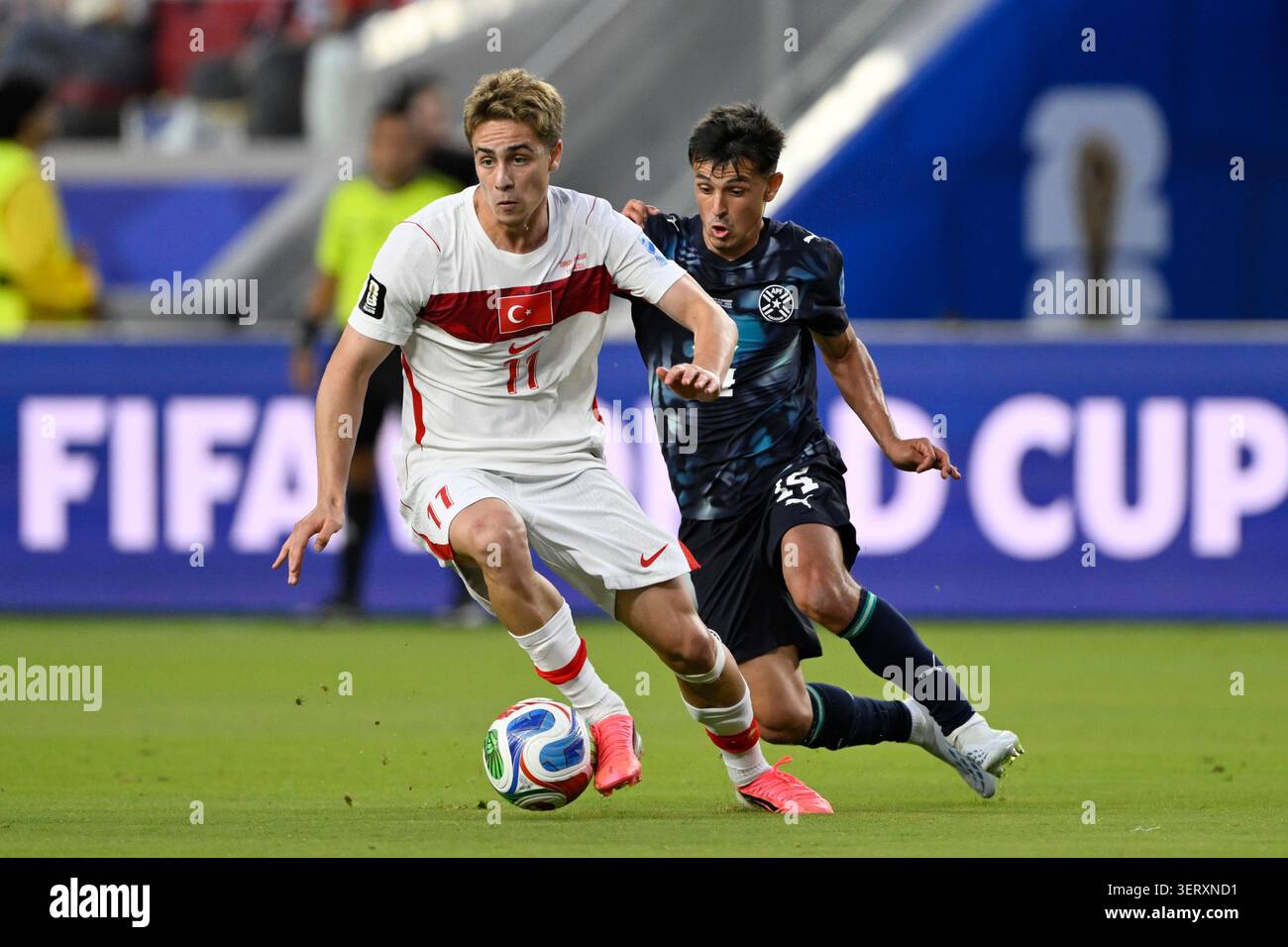 Turkey's Kenan Yildiz (11) controls the ball against Paraguay's Andres ...