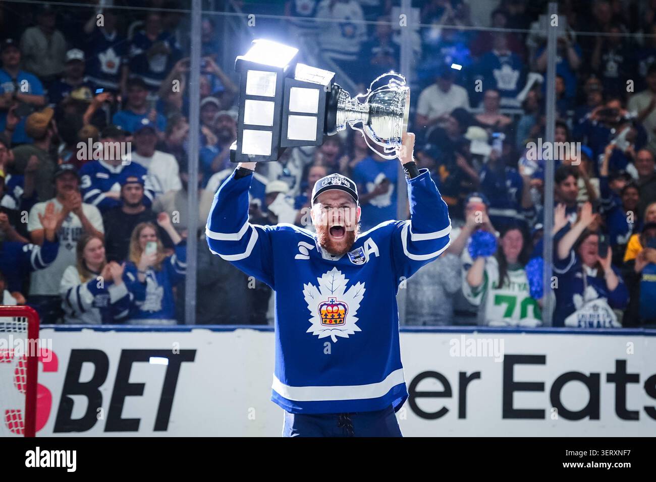 Toronto Marlies defenseman Dakota Mermis (36) hoists the Calder Cup ...