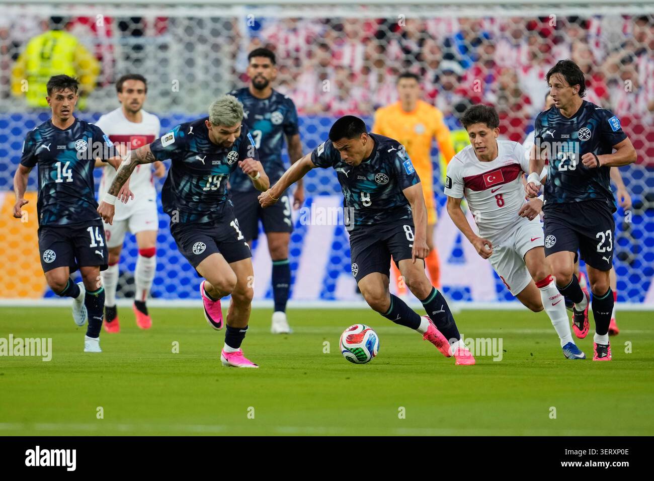 Paraguay's Diego Gomez (8), center, takes control of the ball during ...