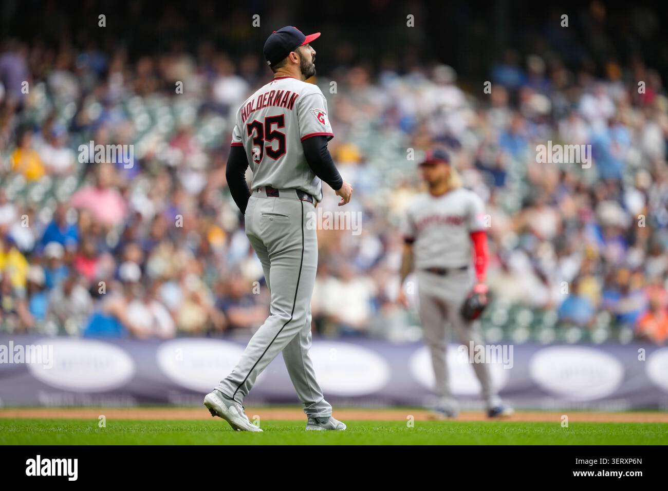 Cleveland Guardians pitcher Colin Holderman looks on after hitting ...
