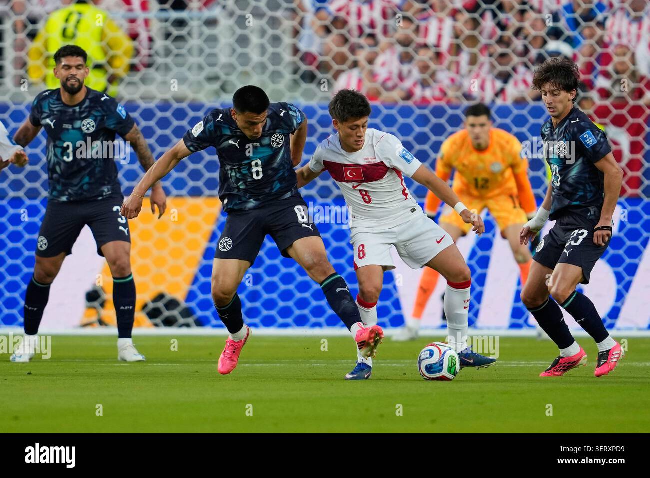 Turkey's Arda Guler (8) battles for the ball with Paraguay's Diego ...