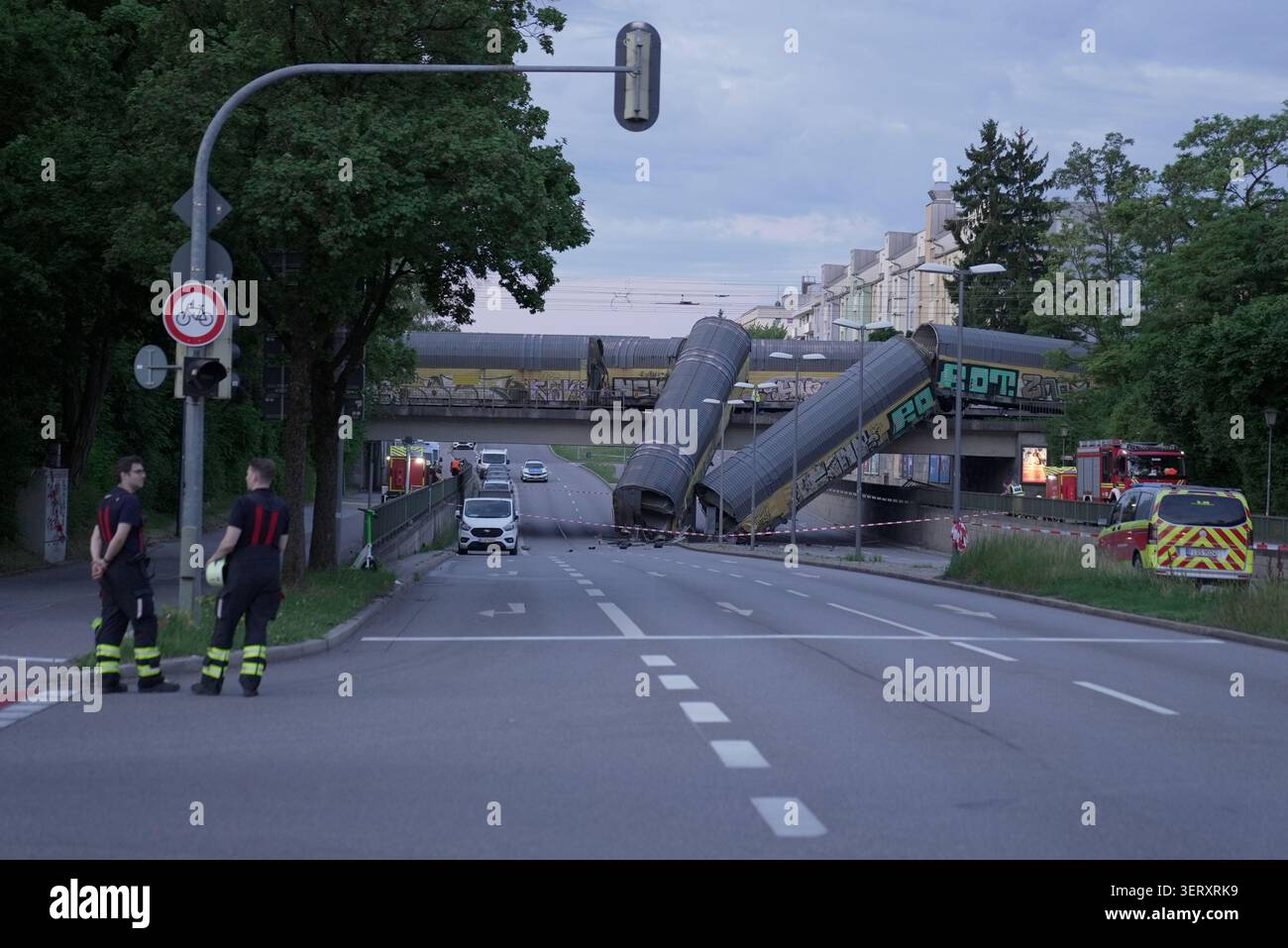 20 June 2026, Bavaria, Munich: Two cars of a freight train are lying on ...