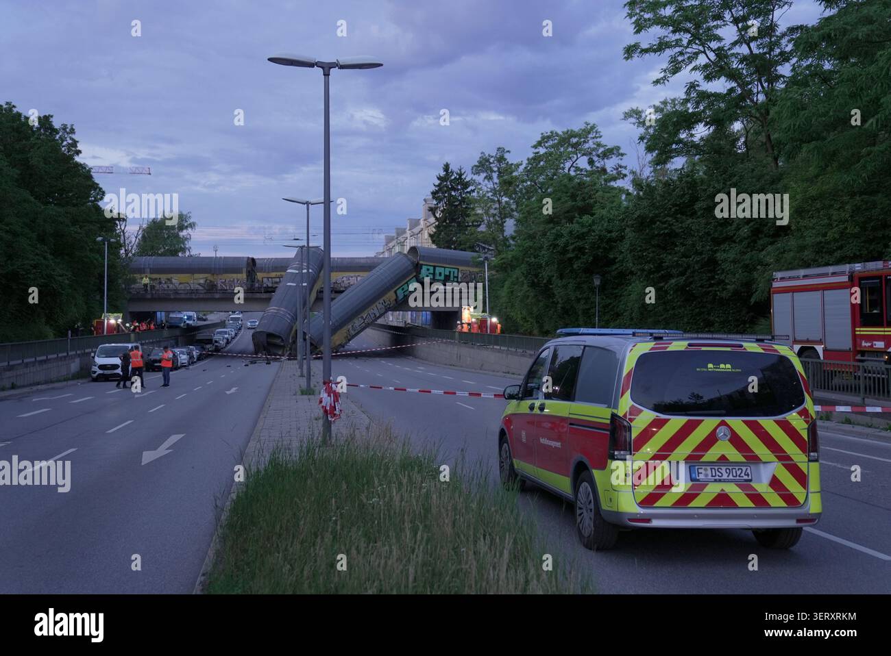 20 June 2026, Bavaria, Munich: Two cars of a freight train are lying on ...