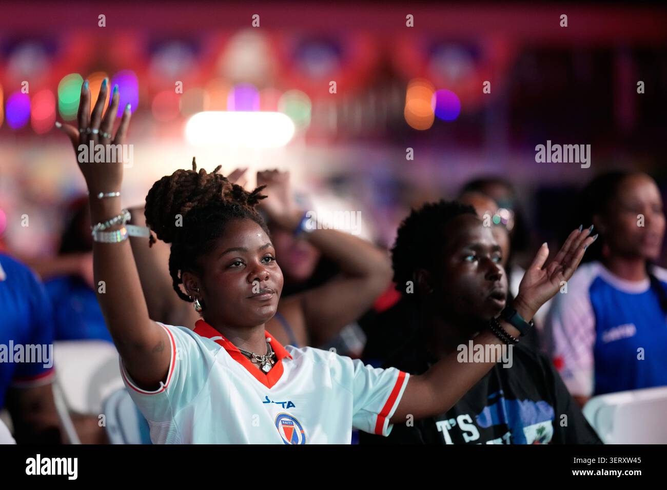 A Haiti fan reacts as people watch a live broadcast of the World Cup ...
