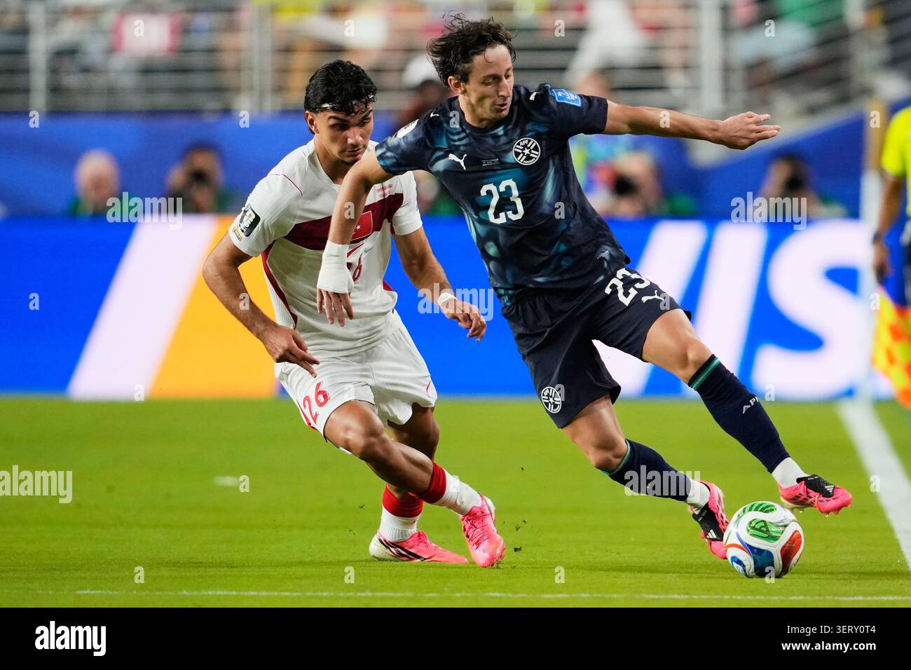 Paraguay's Matias Galarza (23) battles for the ball with Turkey's Can ...
