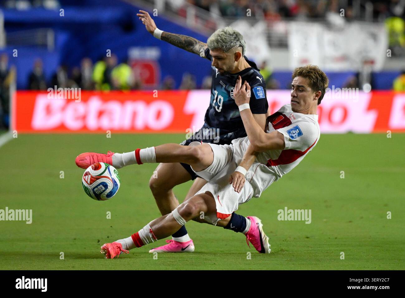 Paraguay's Julio Enciso (19) challenges for the ball with Turkey's ...