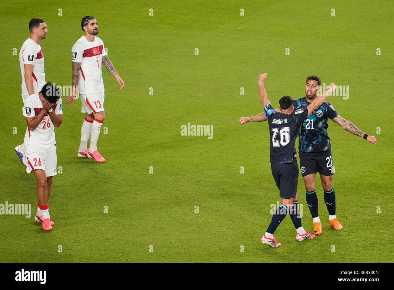 Players of Paraguay, right, reacts at the end of a World Cup Group D ...
