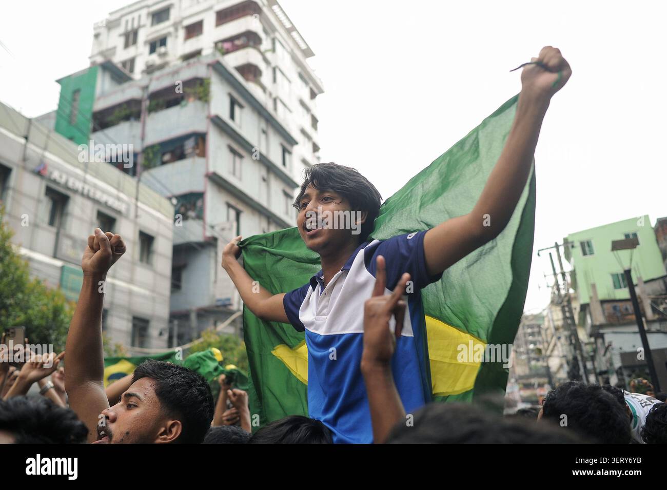 Brazilian fans of Bangladeshi origin celebrate Brazil's 3-0 victory ...
