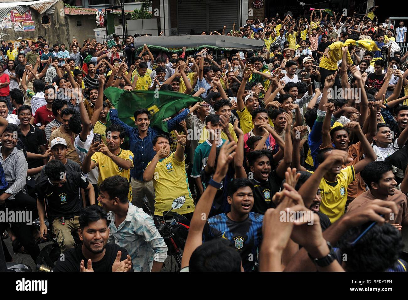 Brazilian fans of Bangladeshi origin celebrate Brazil's 3-0 victory ...