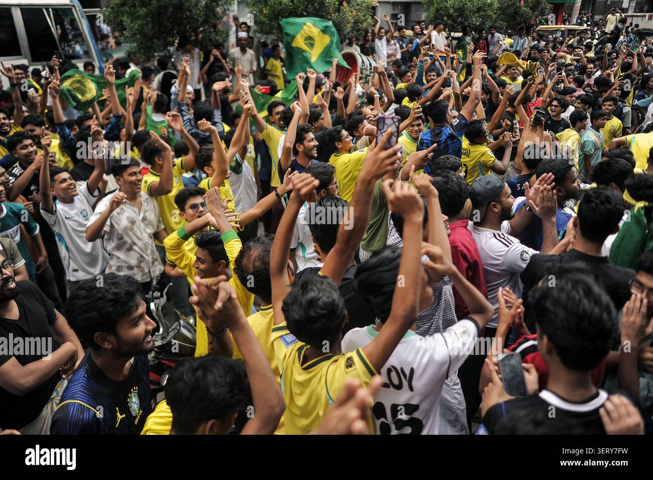 Brazilian fans of Bangladeshi origin celebrate Brazil's 3-0 victory ...