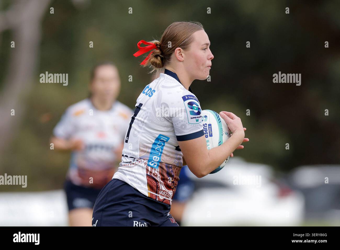 Piper Flynn of the Reds runs the ball during the Super Rugby Women's ...