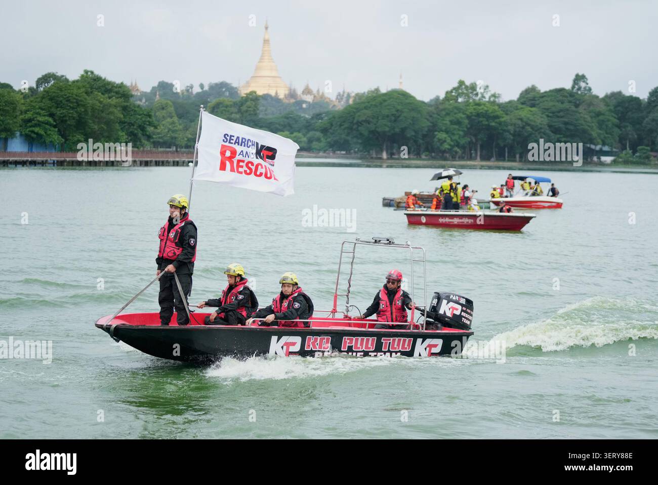 Rescue volunteers drive speedboats during their fire and rescue drill ...