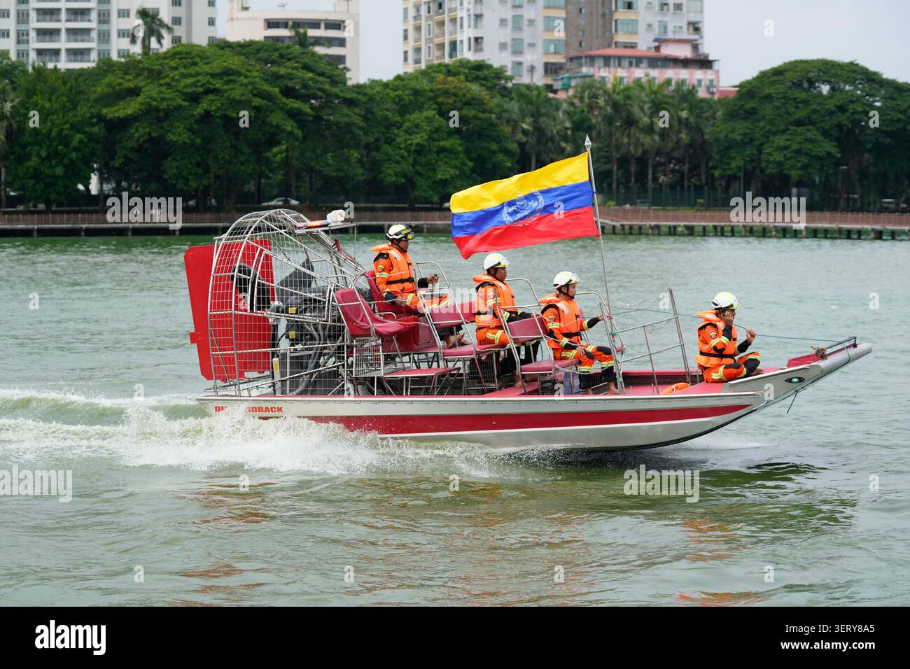 Firefighters drive airboat during their fire and rescue drill at ...