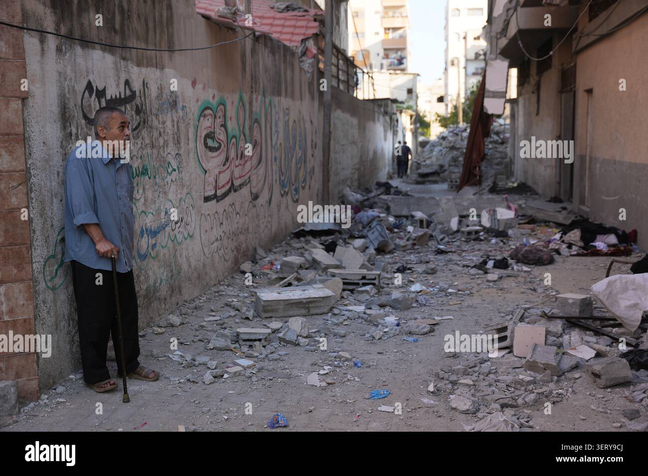 Residents inspect the apartment of the Palestinian Safadi family that ...
