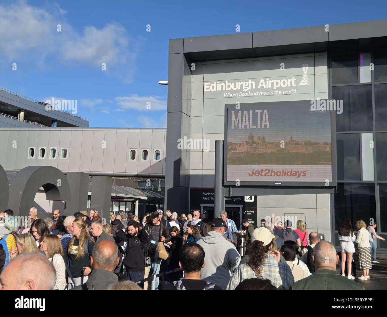 Large queues outside Edinburgh Airport after it reopened in the early ...